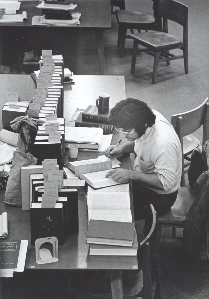 Male student studies at table in library. - Duke University School of Law
